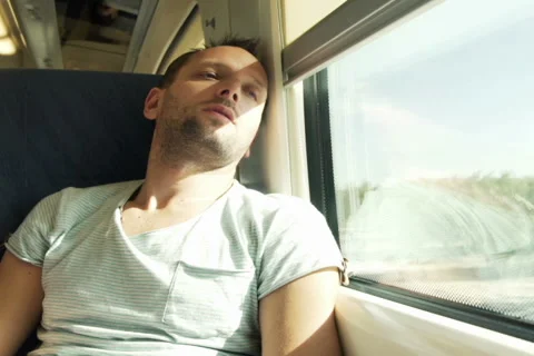 Young sad man sitting in the train and l... | Stock Video | Pond5