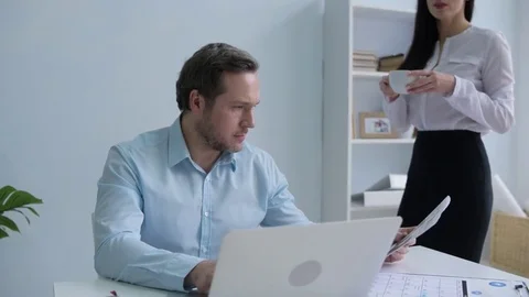 Young secretary massaging back of her bo... | Stock Video | Pond5