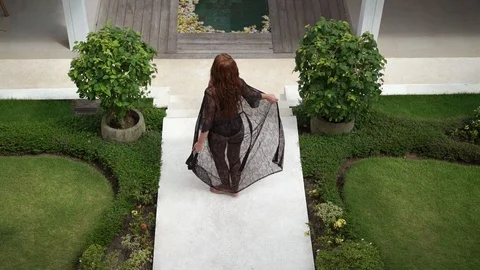 Young sexy red-hair woman in black linge... | Stock Video | Pond5