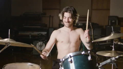 Young shirtless male drummer with beard ... | Stock Video | Pond5