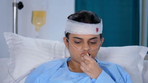 A young sick Indian woman with a head in... | Stock Video | Pond5