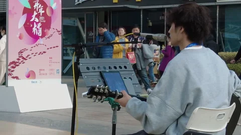 Young singer operating an Ipad during a ... | Stock Video | Pond5