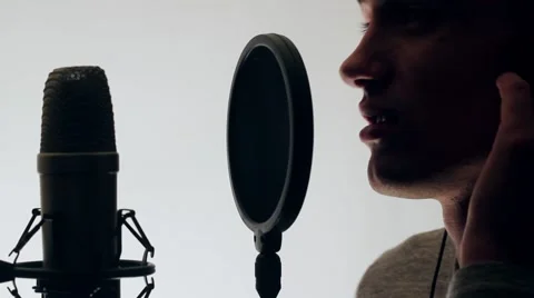 The young singer rapping into a micropho... | Stock Video | Pond5