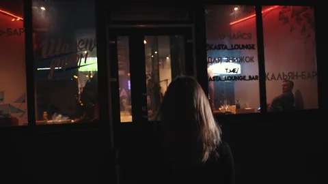 young slender girl, walks into bar, open... | Stock Video | Pond5