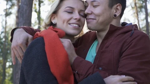 Young smiling couple in love kissing on ... | Stock Video | Pond5