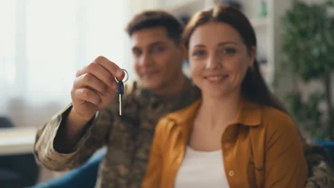 Young soldier and wife showing keys from... | Stock Video | Pond5