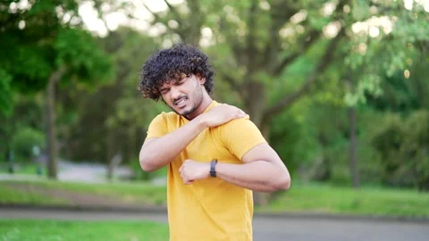 A young sportsman feels sharp pain in hi... | Stock Video | Pond5