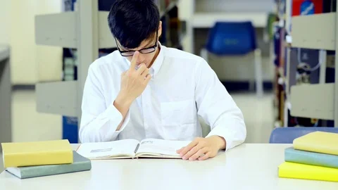 Young student study hard in library. | Stock Video | Pond5