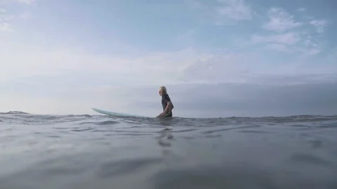 Young Surfer Floating Waiting For A Wave | Stock Video | Pond5