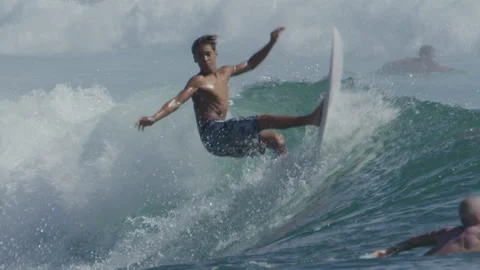 Young teen Surfer surfing tropical ocean... | Stock Video | Pond5