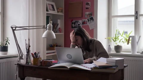 Young teenage girl studying in her room. | Stock Video | Pond5