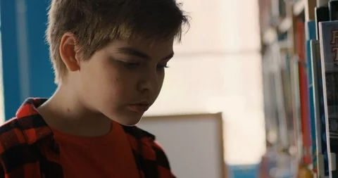 Boy Reading Book Stock Footage ~ Royalty Free Stock Videos | Pond5