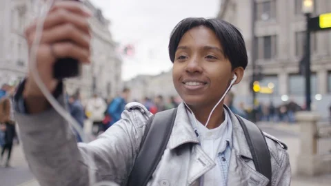 Young transgender man walking through th... | Stock Video | Pond5