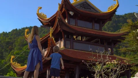 young woman and her son visiting a budhi... | Stock Video | Pond5
