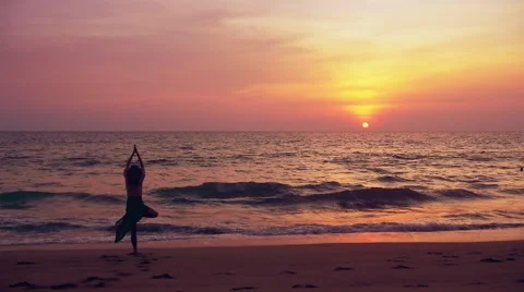 Young Woman Beach Yoga Sunset Tree Pose ... | Stock Video | Pond5