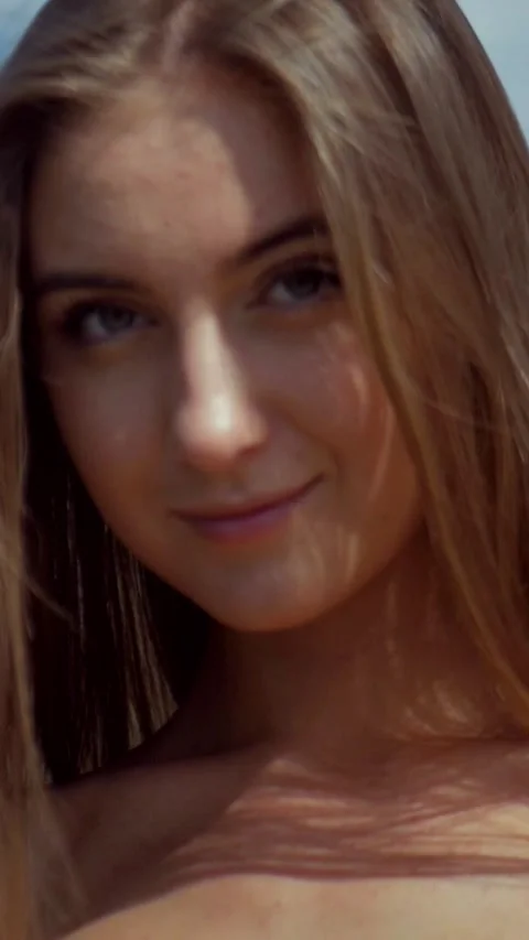 young woman in a bikini on the beach. Ve... | Stock Video | Pond5