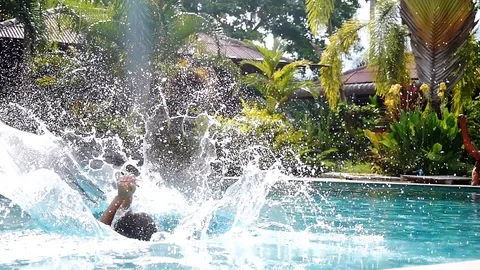 Young woman in black bikini jumping into... | Stock Video | Pond5