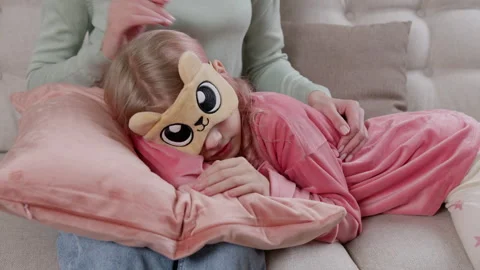 A young woman caressing a girl lying on ... | Stock Video | Pond5