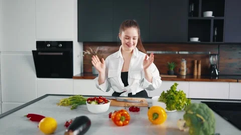 Young woman cooking, dancing at kitchen.... | Stock Video | Pond5