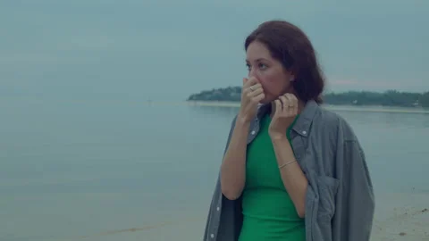 Young woman crying on the beach, looking... | Stock Video | Pond5