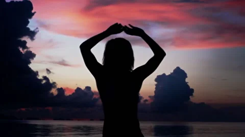 Young woman dancing at sunset background... | Stock Video | Pond5