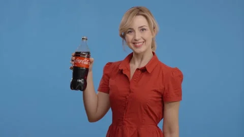 Young woman drinking Coca Cola -Zero Sug... | Stock Video | Pond5