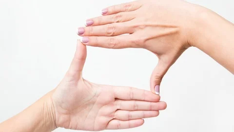 Young woman forming square frame with he... | Stock Video | Pond5