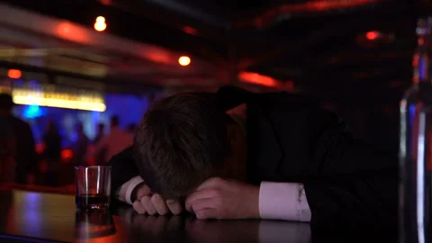 Young woman helping drunk man to leave b... | Stock Video | Pond5