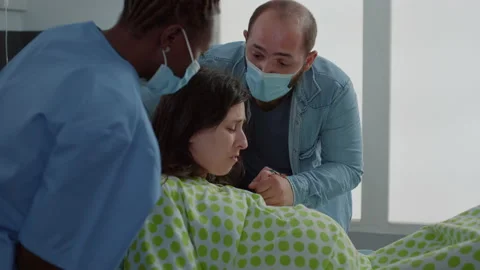 Young woman in labor giving birth to bab... | Stock Video | Pond5