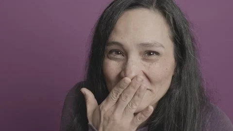 Young Woman Laughing With Hand Over Mout... | Stock Video | Pond5