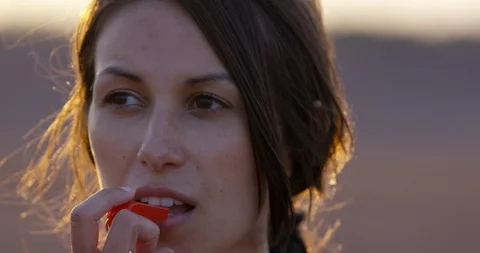 Young woman lifeguard at beach places wh... | Stock Video | Pond5