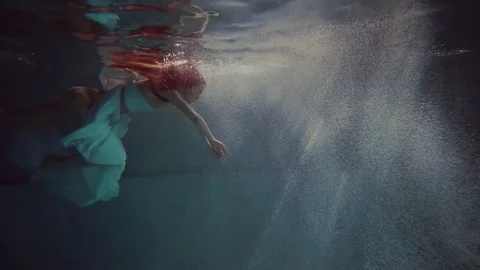 young woman with long red hair swimming ... | Stock Video | Pond5