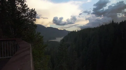 Young woman looks over a railing at beau... | Stock Video | Pond5