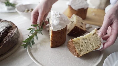 Young woman putting sliced cake on a pla... | Stock Video | Pond5