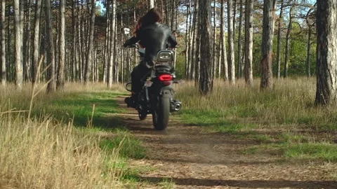 Young Woman Rides A Motorcycle In The Fo... | Stock Video | Pond5