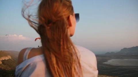 Young woman rise up hands to the wind in... | Stock Video | Pond5