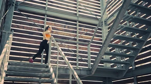 Young woman runner, jump on up the stair... | Stock Video | Pond5