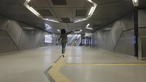 Young woman running with hands wide open... | Stock Video | Pond5