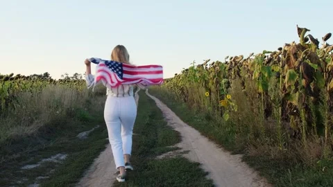 Young woman running with Waving American... | Stock Video | Pond5