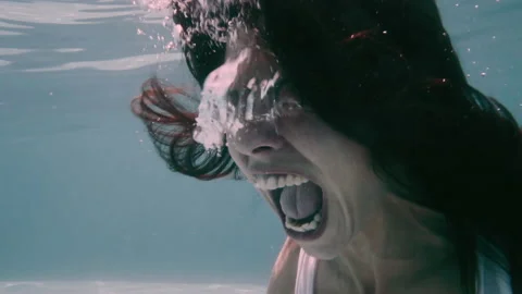 Young woman screams underwater | Stock Video | Pond5
