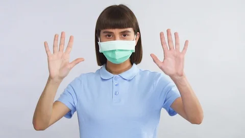 young woman shows stop sign with her bot... | Stock Video | Pond5