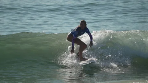 Young woman surfer surfing ocean waves a... | Stock Video | Pond5