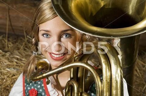 Young woman in traditional costume, with tuba, portrait Stock Image ...