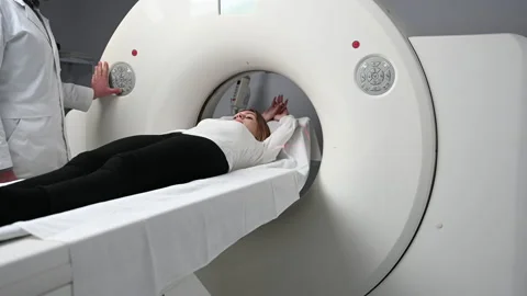 A young woman is undergoing a CT scan pr... | Stock Video | Pond5