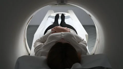 A young woman is undergoing a CT scan pr... | Stock Video | Pond5