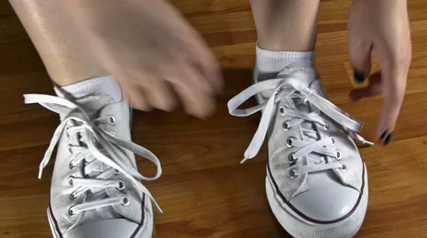 Young Woman Untying The Shoelaces Of Her... | Stock Video | Pond5