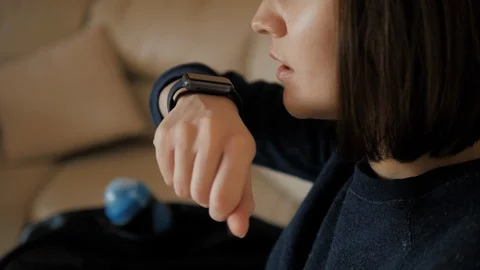 Young woman uses smartwatch voice recogn... | Stock Video | Pond5