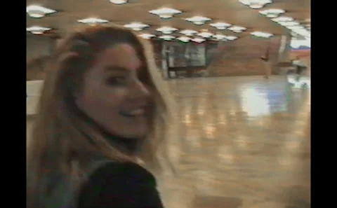 Young woman walking into a building - VH... | Stock Video | Pond5