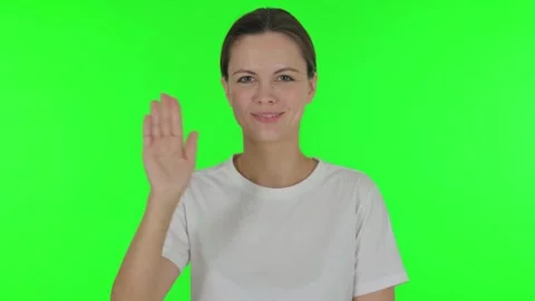 Young Woman Waving Hand to Welcome on Gr... | Stock Video | Pond5