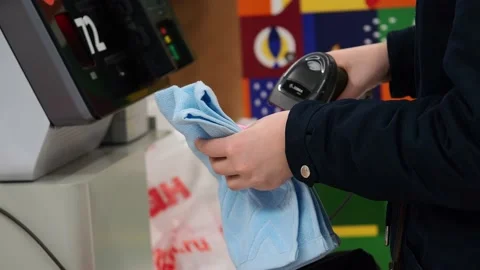 A young woman's hands scan things at the... | Stock Video | Pond5